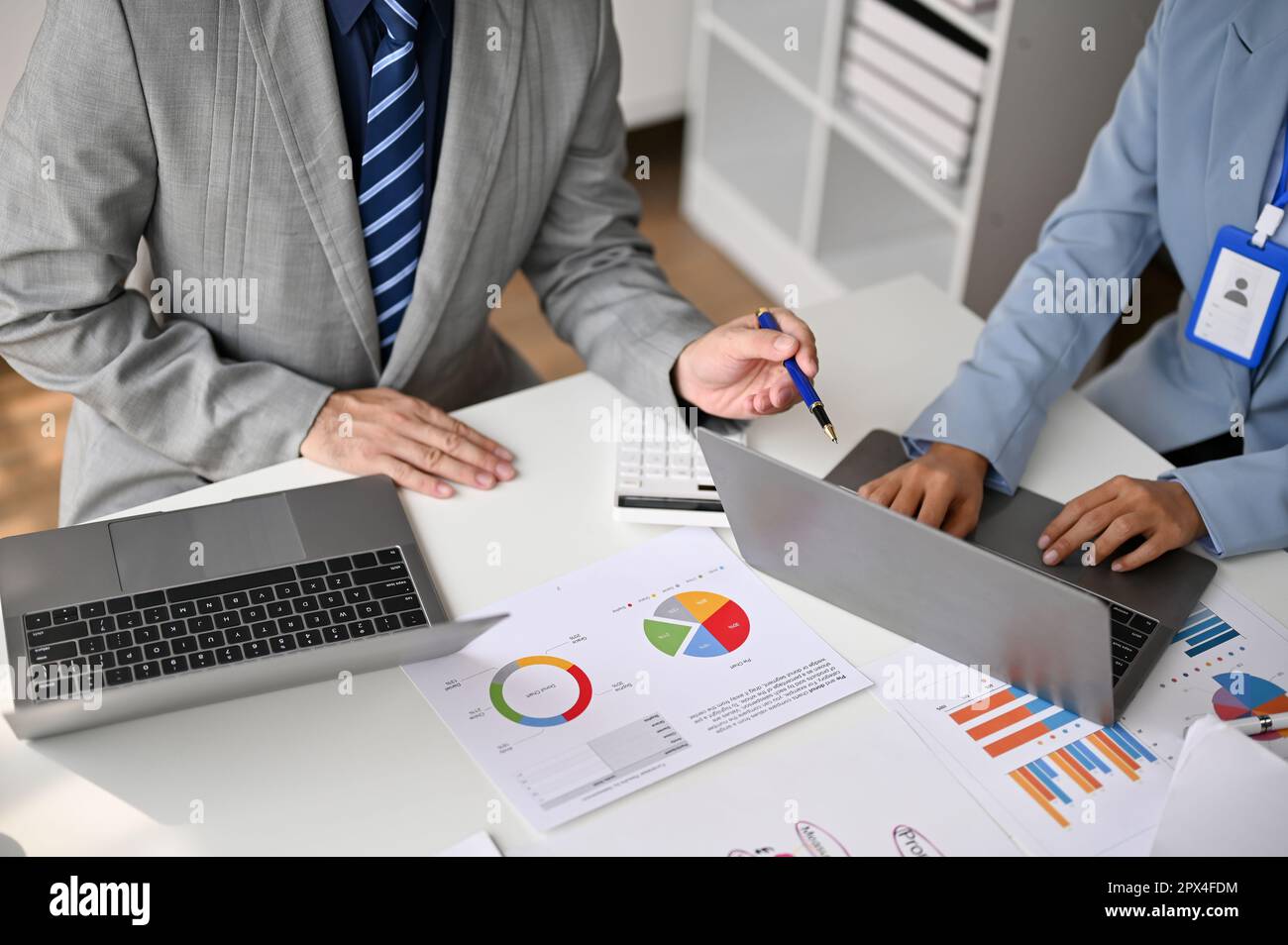 Professional male boss working with his financial team in the meeting ...