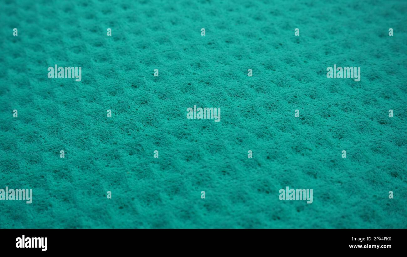 Sponge fibers sponge texture pattern surface close-up green background ...