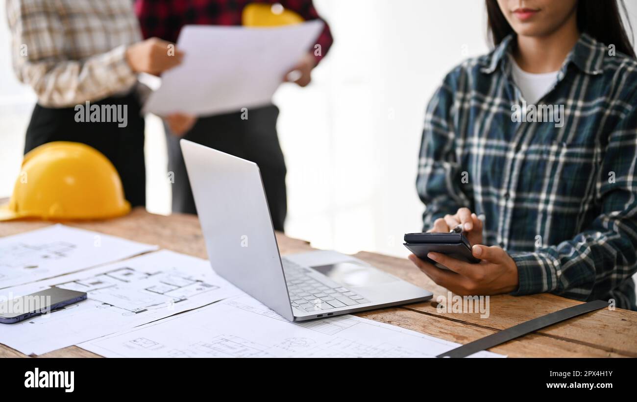 Close-up image of an Asian female engineer measuring and checking ...