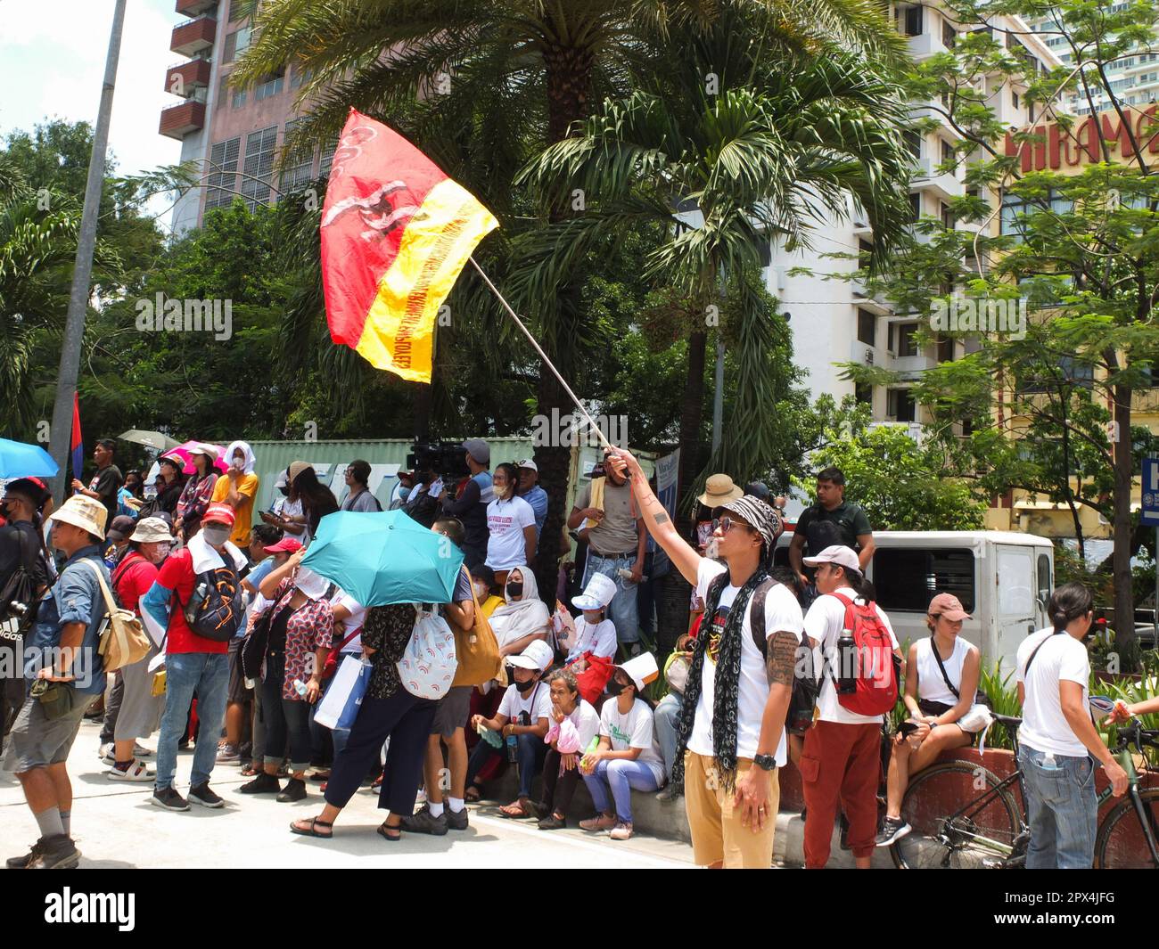 Manila, Philippines. 01st May, 2023. A protester seen waving a flag ...