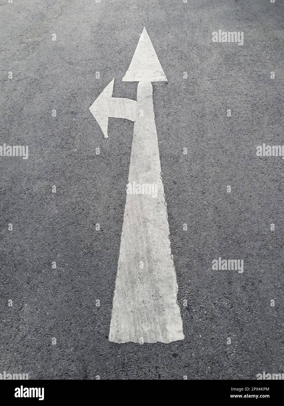 Road, with white arrow sign Stock Photo - Alamy