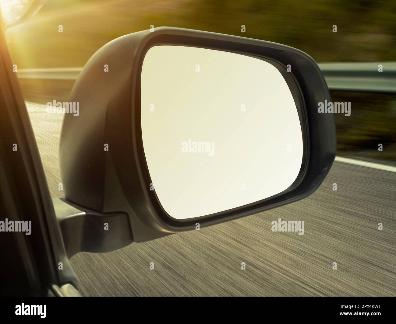 view mirrors in cars at the setting sun, blurred landscape Stock Photo ...