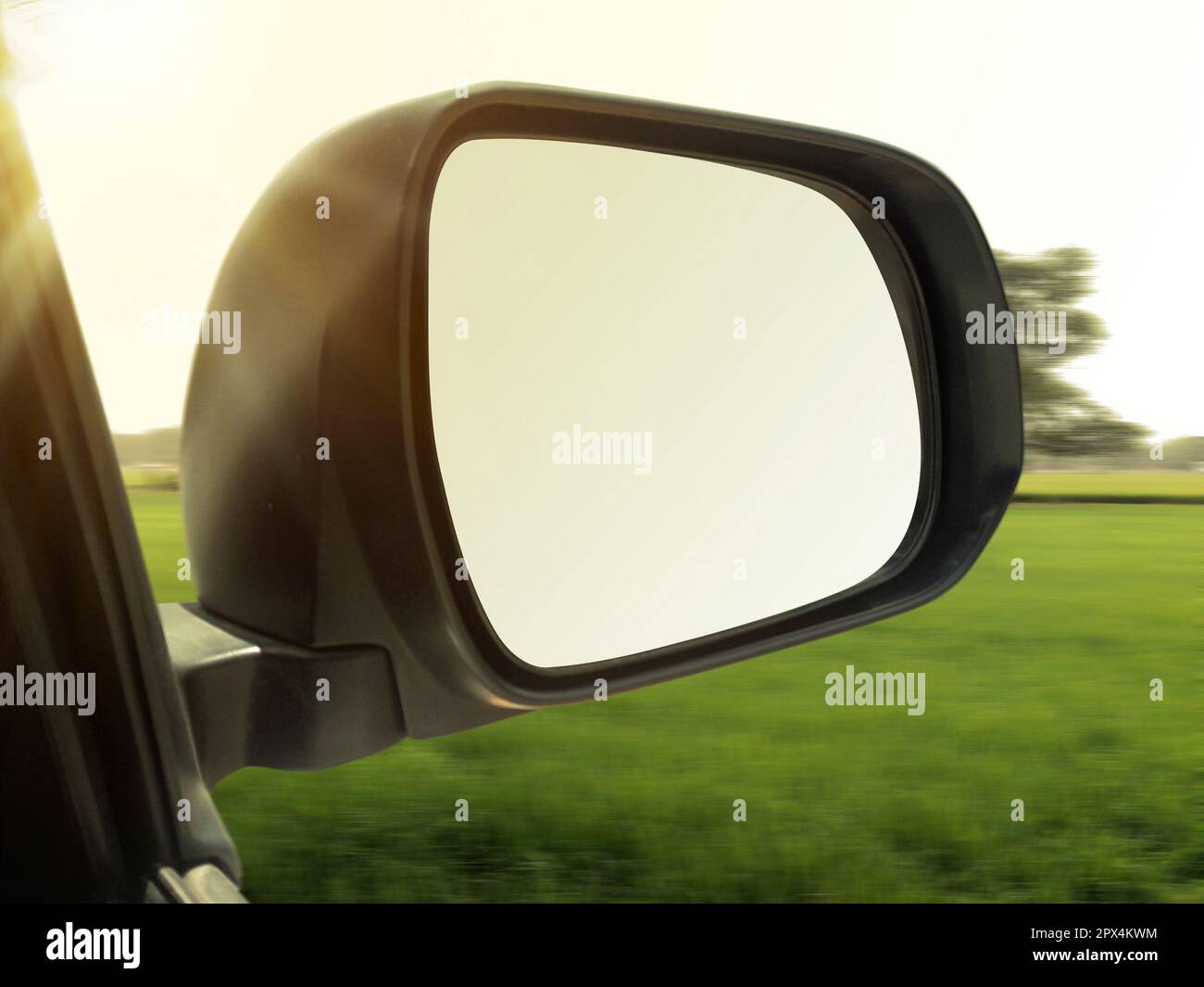 view mirrors in cars at the setting sun, blurred landscape Stock Photo ...