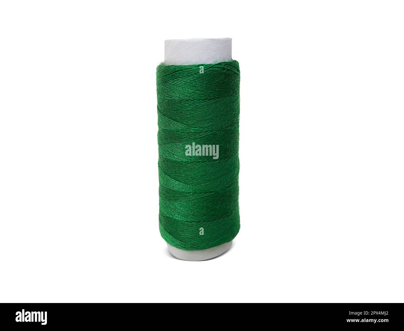 The coil with green threads. White background Stock Photo - Alamy