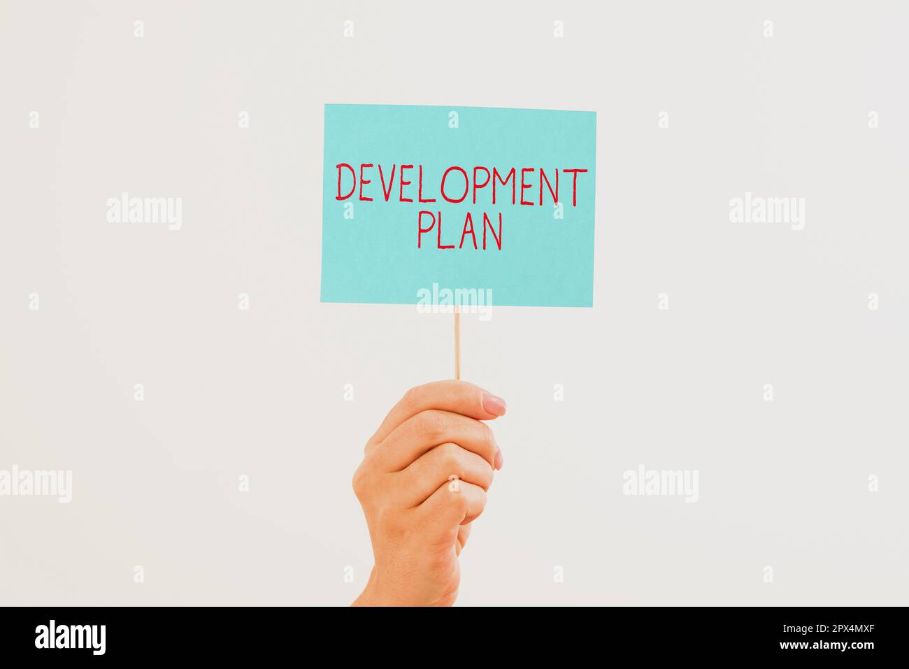 Sign displaying Development Plan, Business idea the planning of the ...