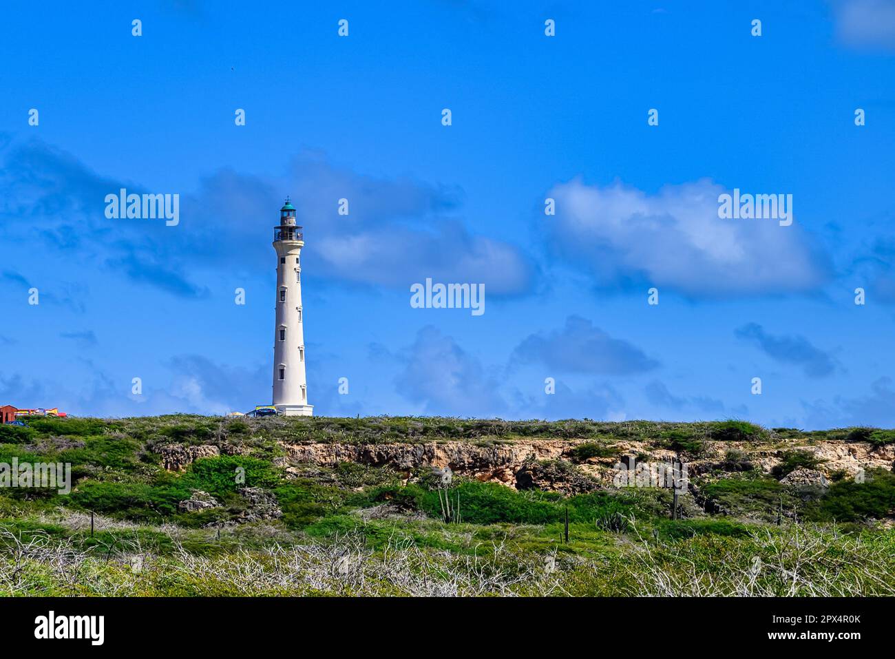The California Lighthouse on the Caribbean island of Aruba under a blue ...