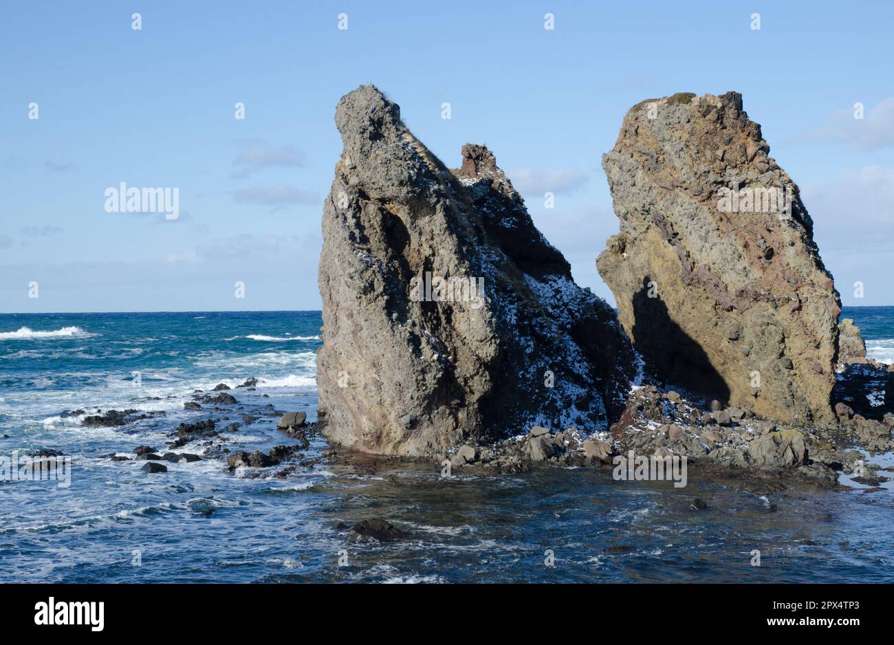 Rocky cliffs in the west coast of the Shiretoko Peninsula. Hokkaido ...