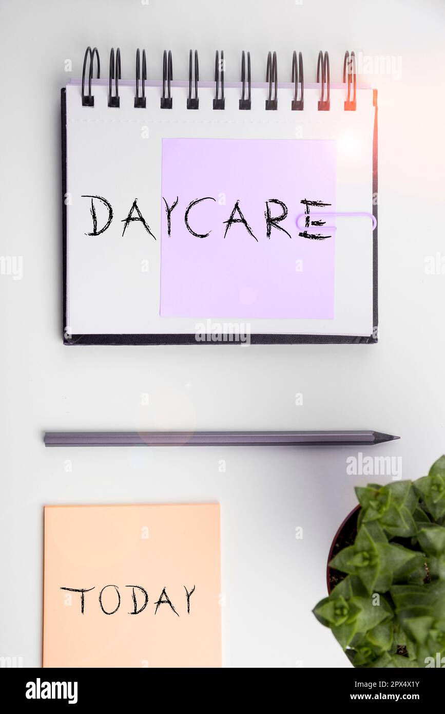 Hand writing sign Daycare, Word Written on offering care to preschool ...
