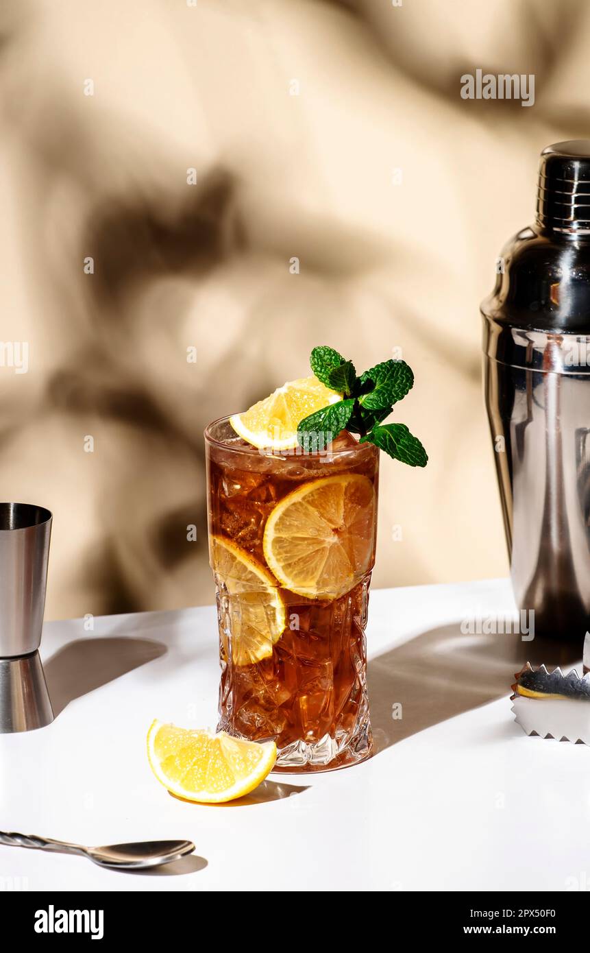 Long Island ice tea cocktail drink with vodka, rum, tequila, gin, liquor, lemon juice, cola and ...