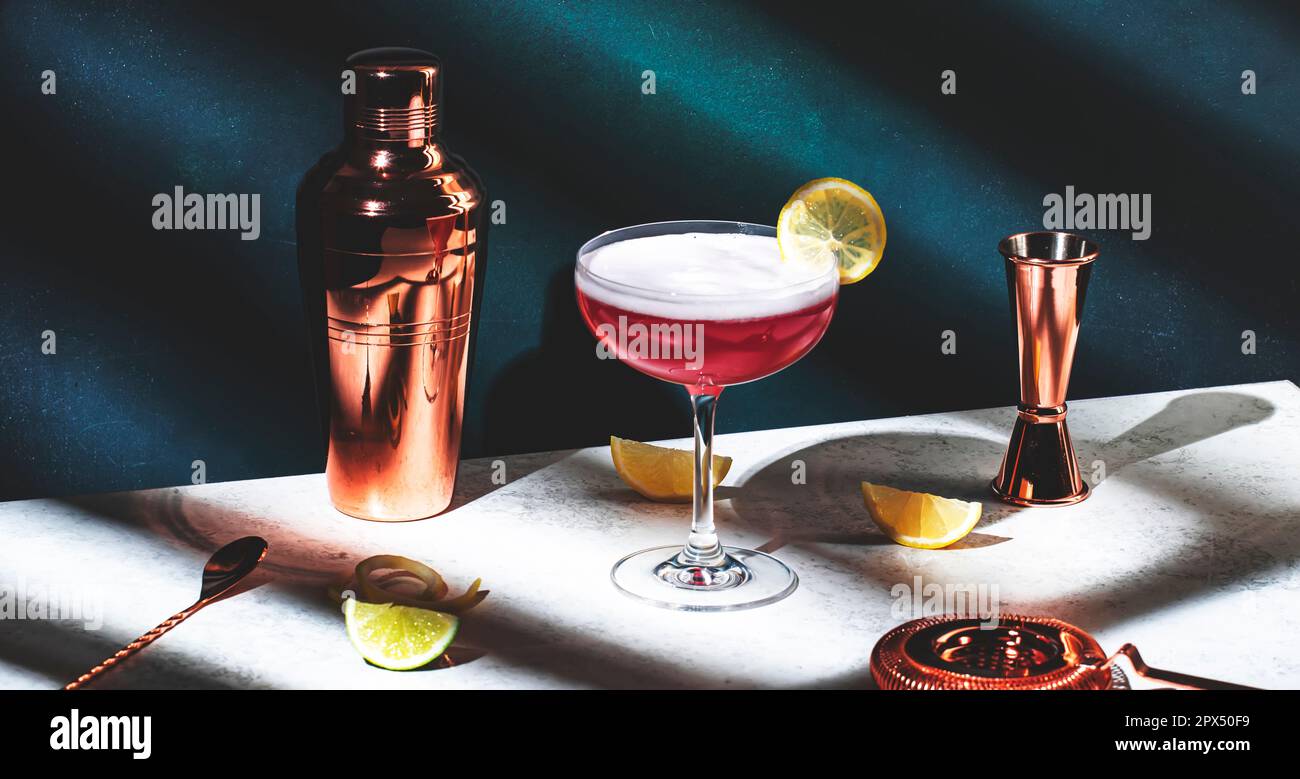 Pink lady classic cocktail drink with dry gin, grenadine syrup, lemon ...