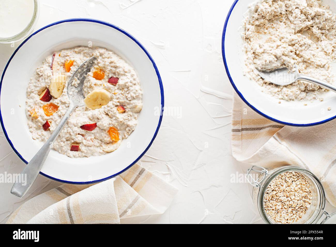 Oatmeal plate. A plate of oatmeal served with fresh fruit and milk ...