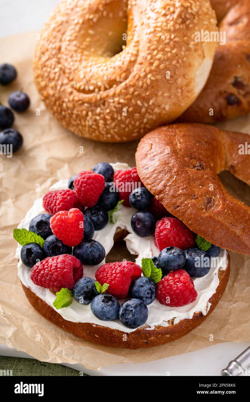 Homemade freshly baked bagels on a parchment paper ready to eat ...
