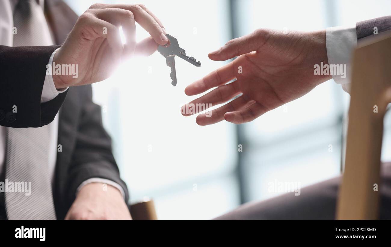 New property owner receiving the keys to his property Stock Photo - Alamy