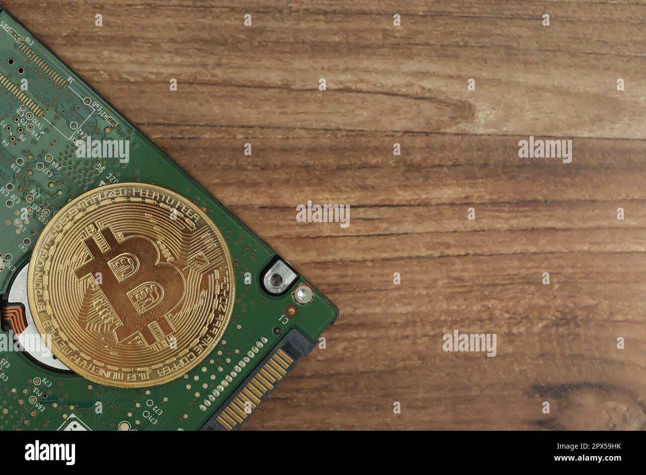 a pile of bitcoin placing above the hard disk. Cryptocurrency trading ...