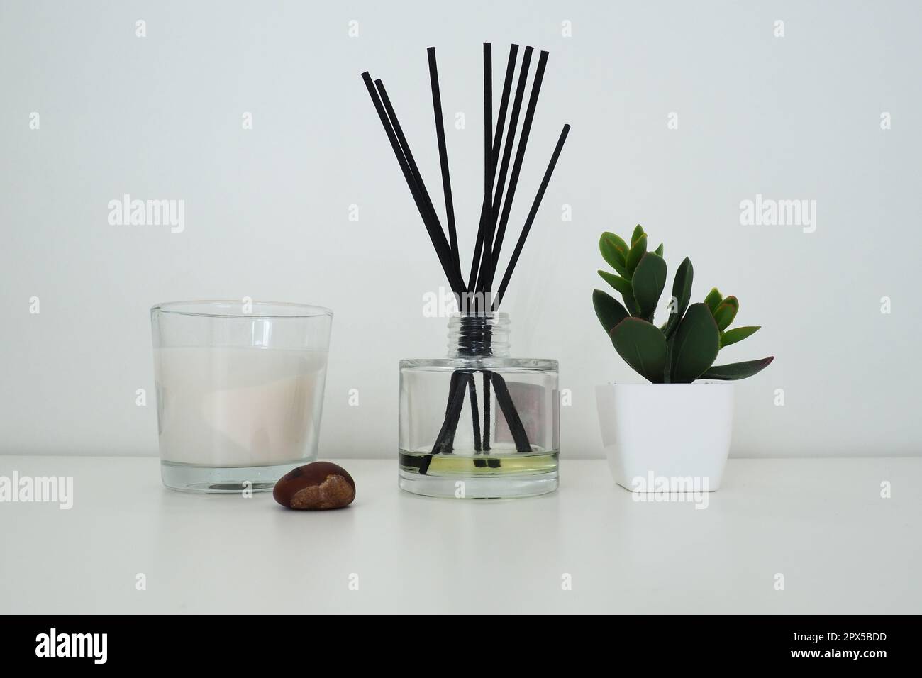 Incense sticks in a glass cubic vase with essential oils. Interior ...