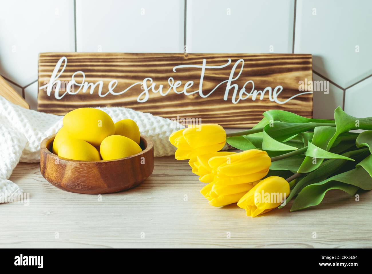 Home sweet home handwritten sign on kitchen countertop, next to wooden ...