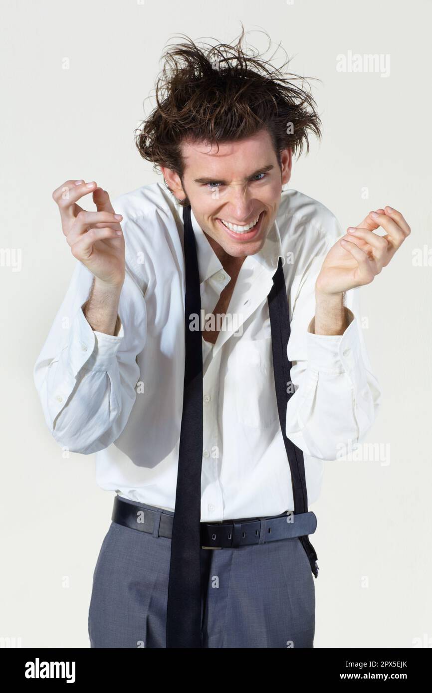 Come closer...A mad young businessman staring at you with a manic glint ...