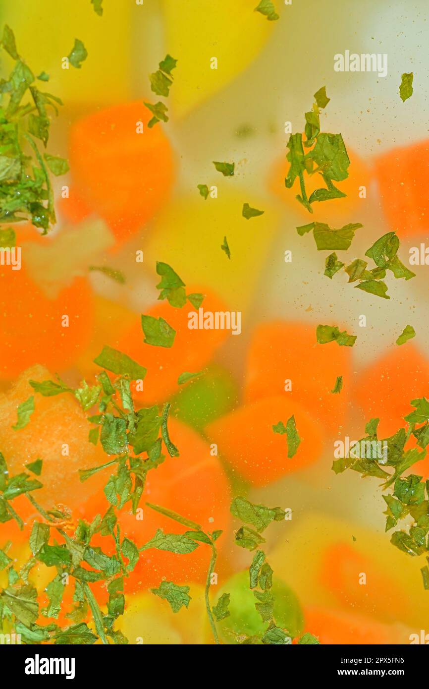 Boiling water with fresh vegetables, close-up. Close-up view of the ...