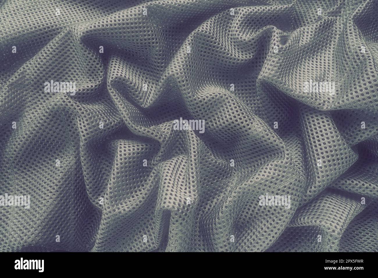 Synthetic fabric with holes laid in waves. Beautiful drape. Fabric for ...