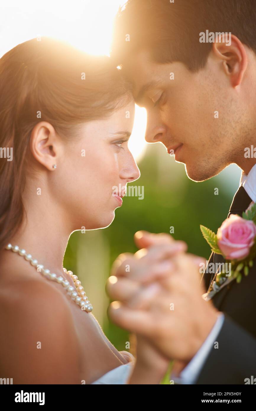 Dancing to their song. Intimate image of a newlywed couple dancing and ...