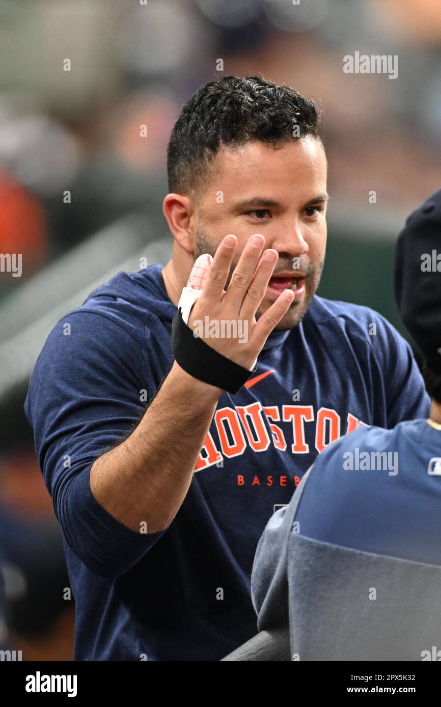 Houston Astros second baseman Jose Altuve recovering from a broken thumb in the dugout during ...