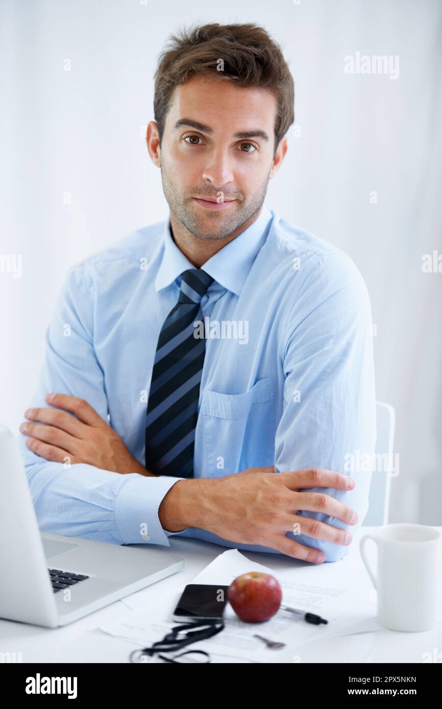 The modern professional. a handsome young businessman at work Stock ...