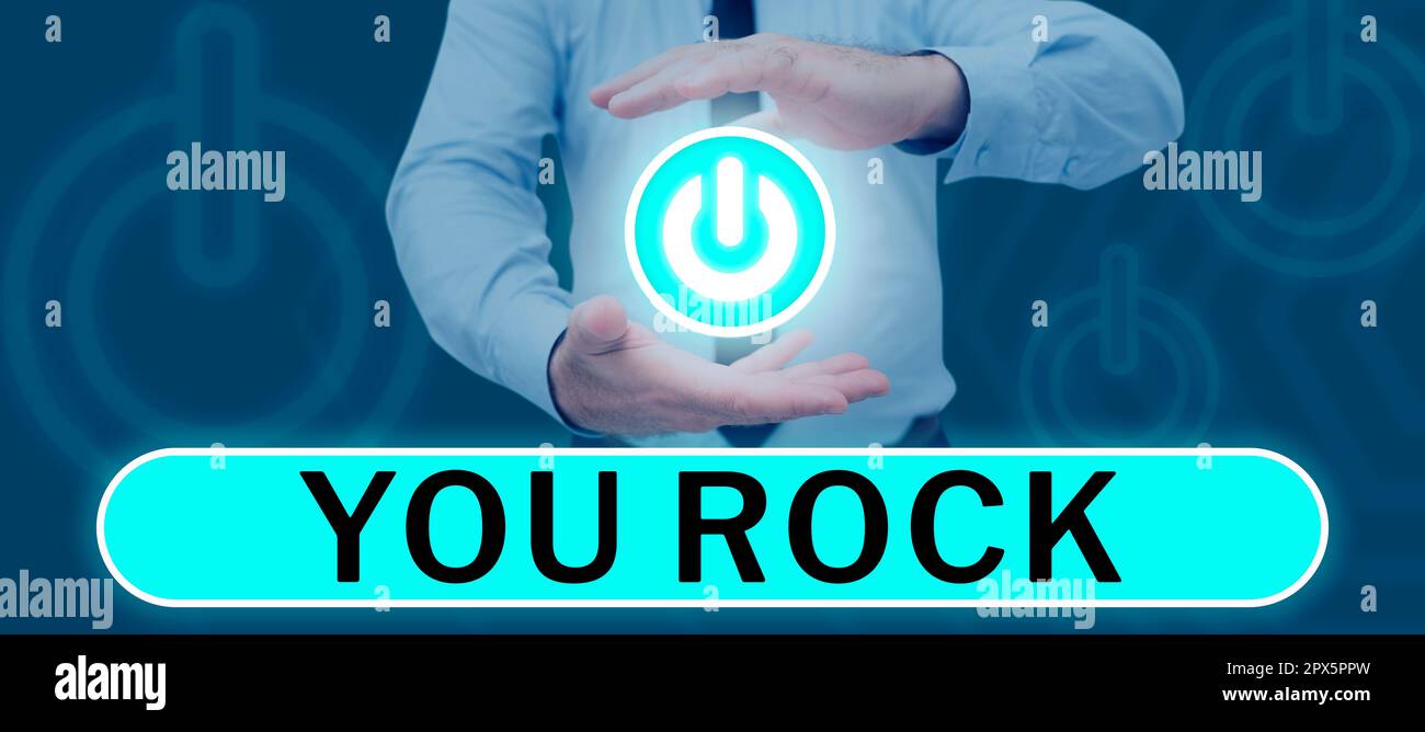 Hand writing sign You Rock, Business approach slang phrase of praise or ...