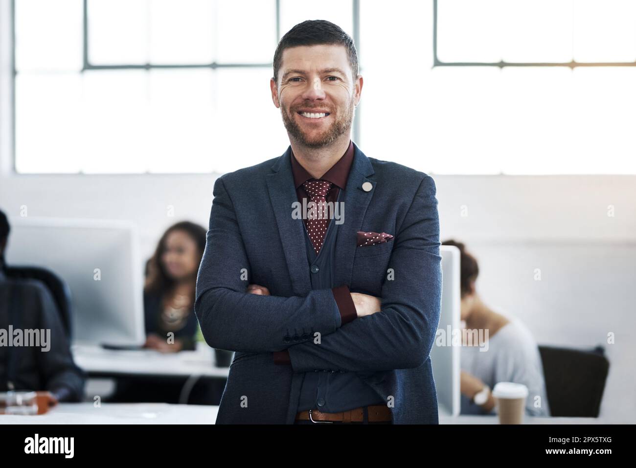 Our office is all about productivity. Portrait of a confident mature ...