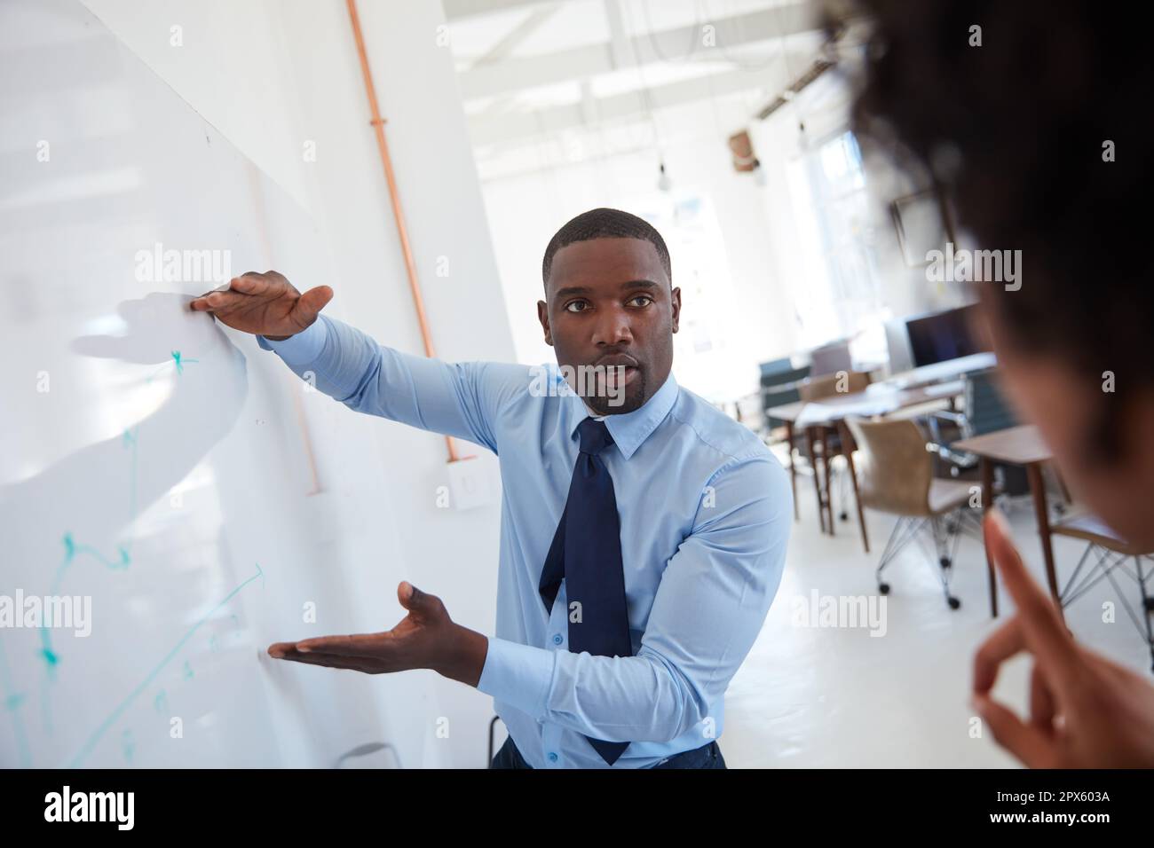 Trying to explain the work before we do it. a young a businessman ...