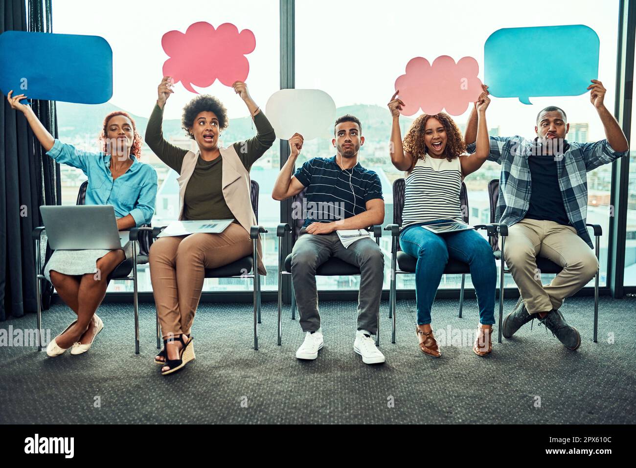 Show me your sign. Portrait of a cheerful young group of work ...