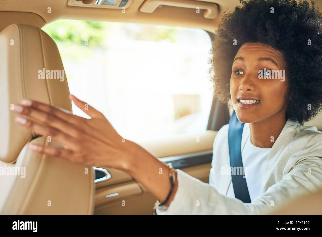 You can take a right turn here. a cheerful young businesswoman seated ...