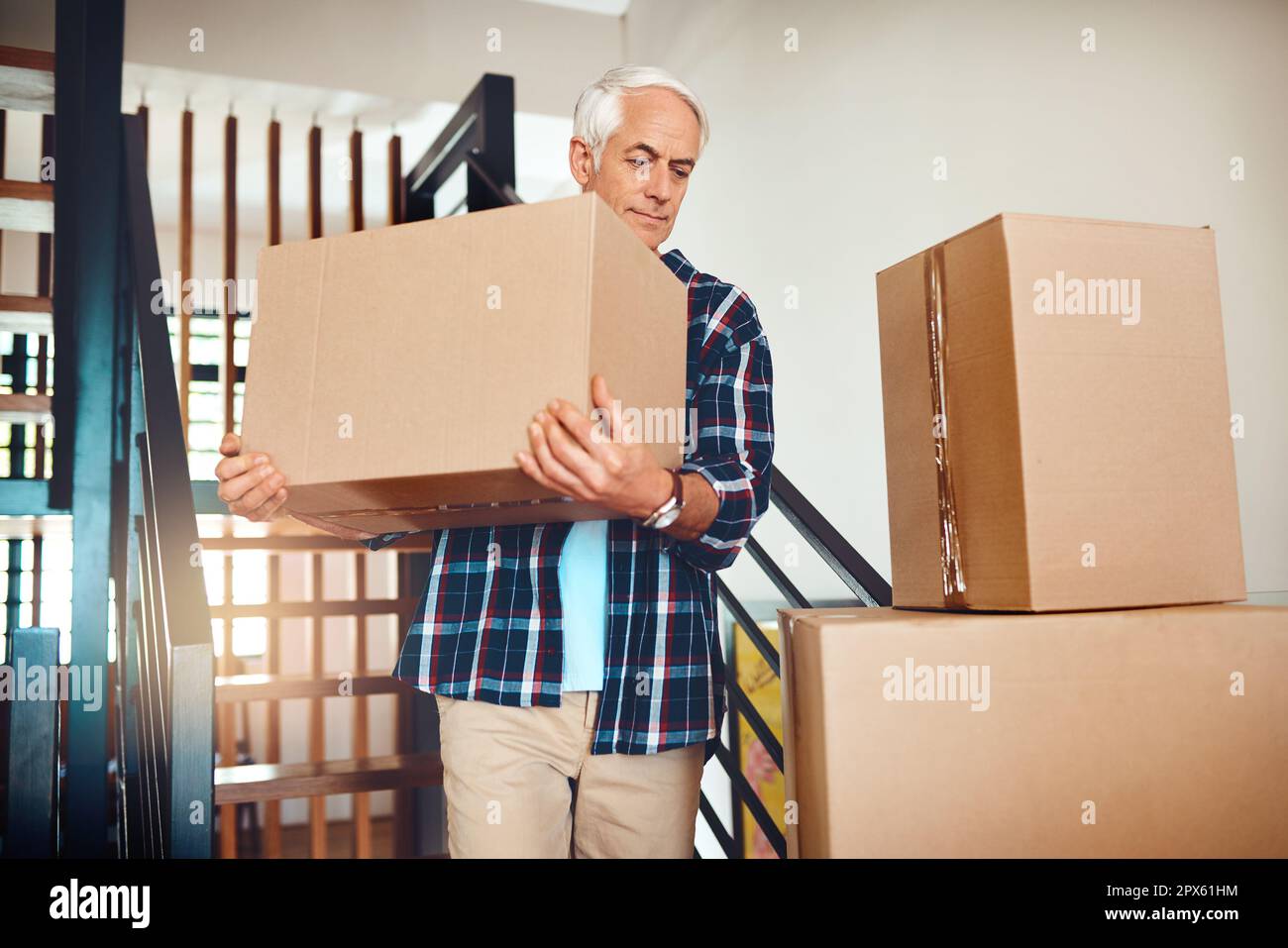 Man carrying boxes stairs hi-res stock photography and images - Alamy