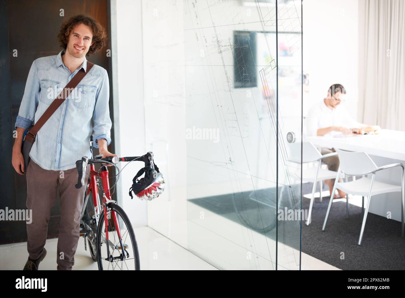 Travelling by bike gets me to work faster. a young businessman arriving ...