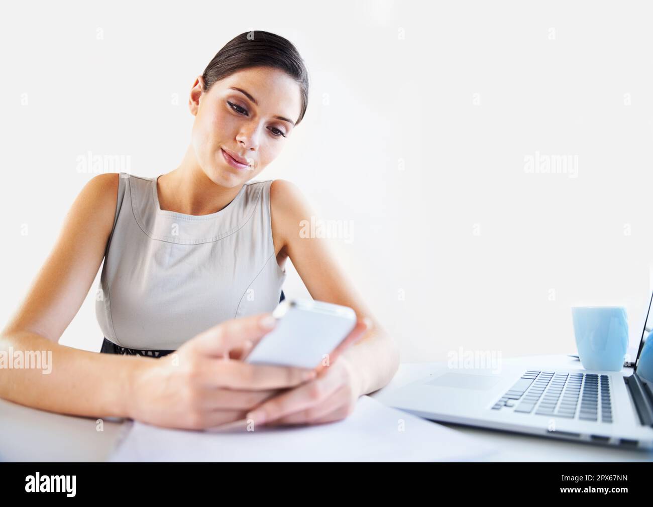 Thinking carefully about her response. a young businesswoman working in ...