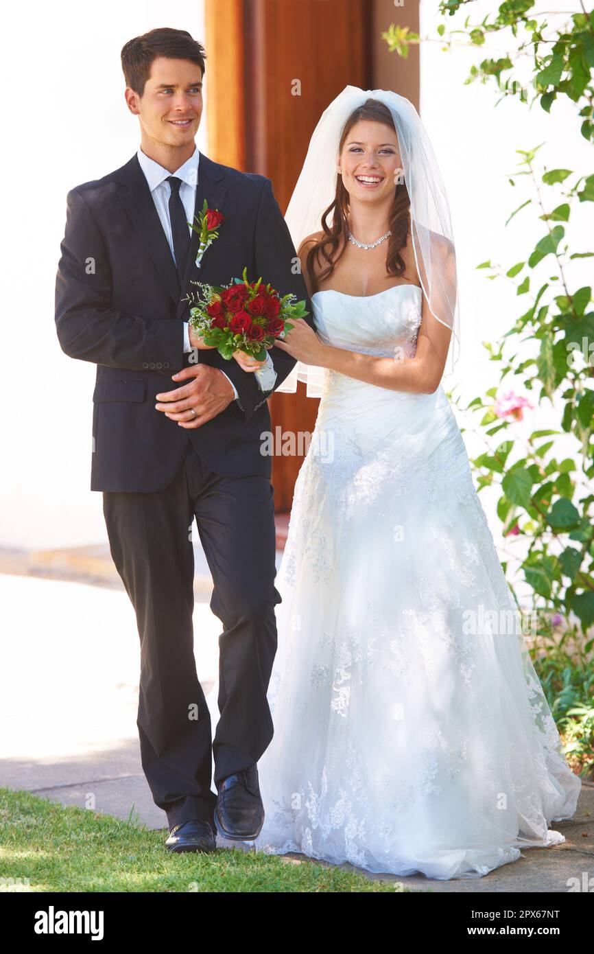 Their first steps as newlyweds. Full length shot of couple of newlyweds ...