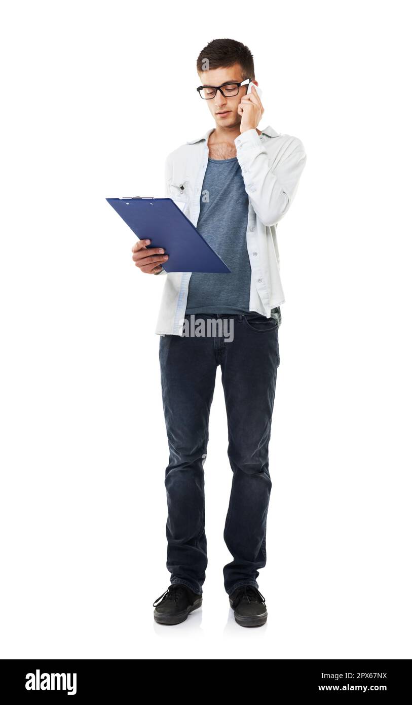 Checking the information. A casual male with glasses on looking at his ...