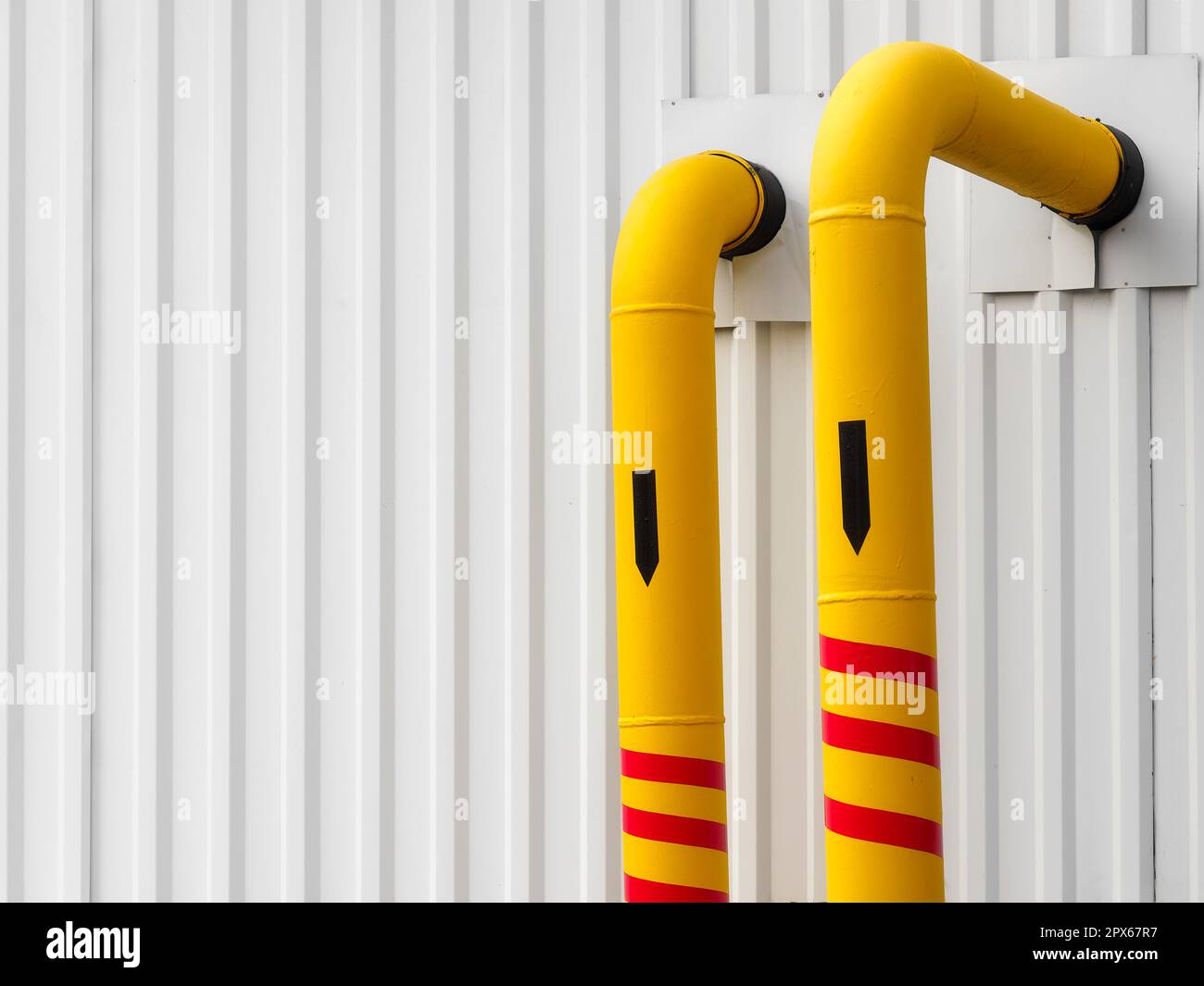 Yellow pipes for transporting gas on white industrial background ...