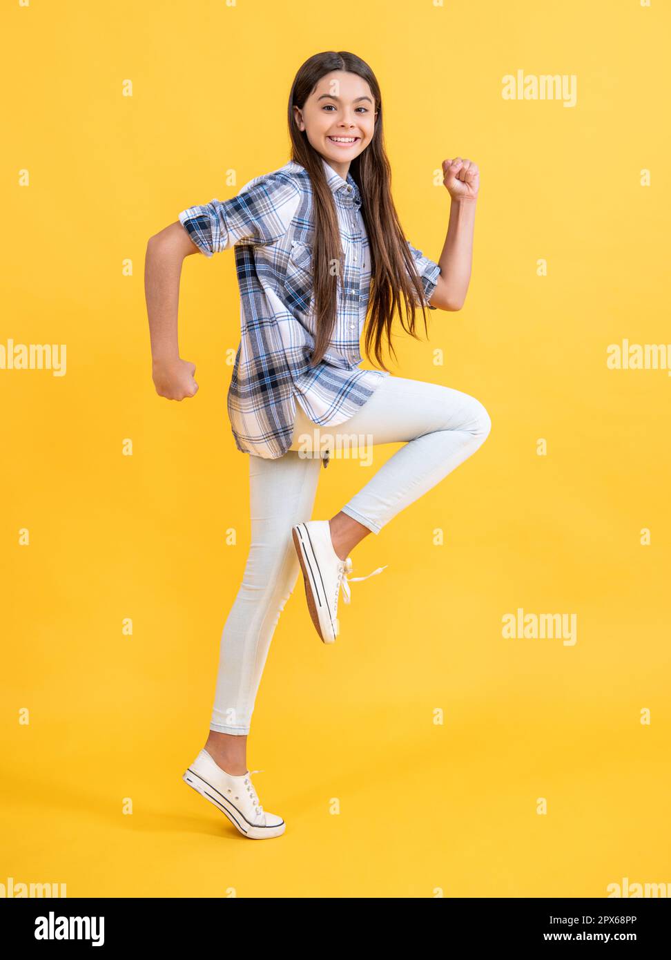 running teen girl in studio. teen girl on background. photo of teen ...
