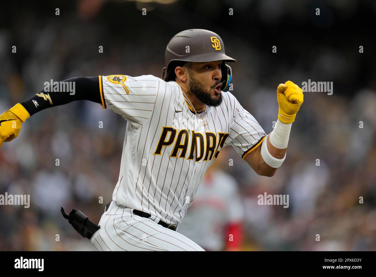 San Diego Padres' Fernando Tatis Jr. runs to first base after hitting a ...