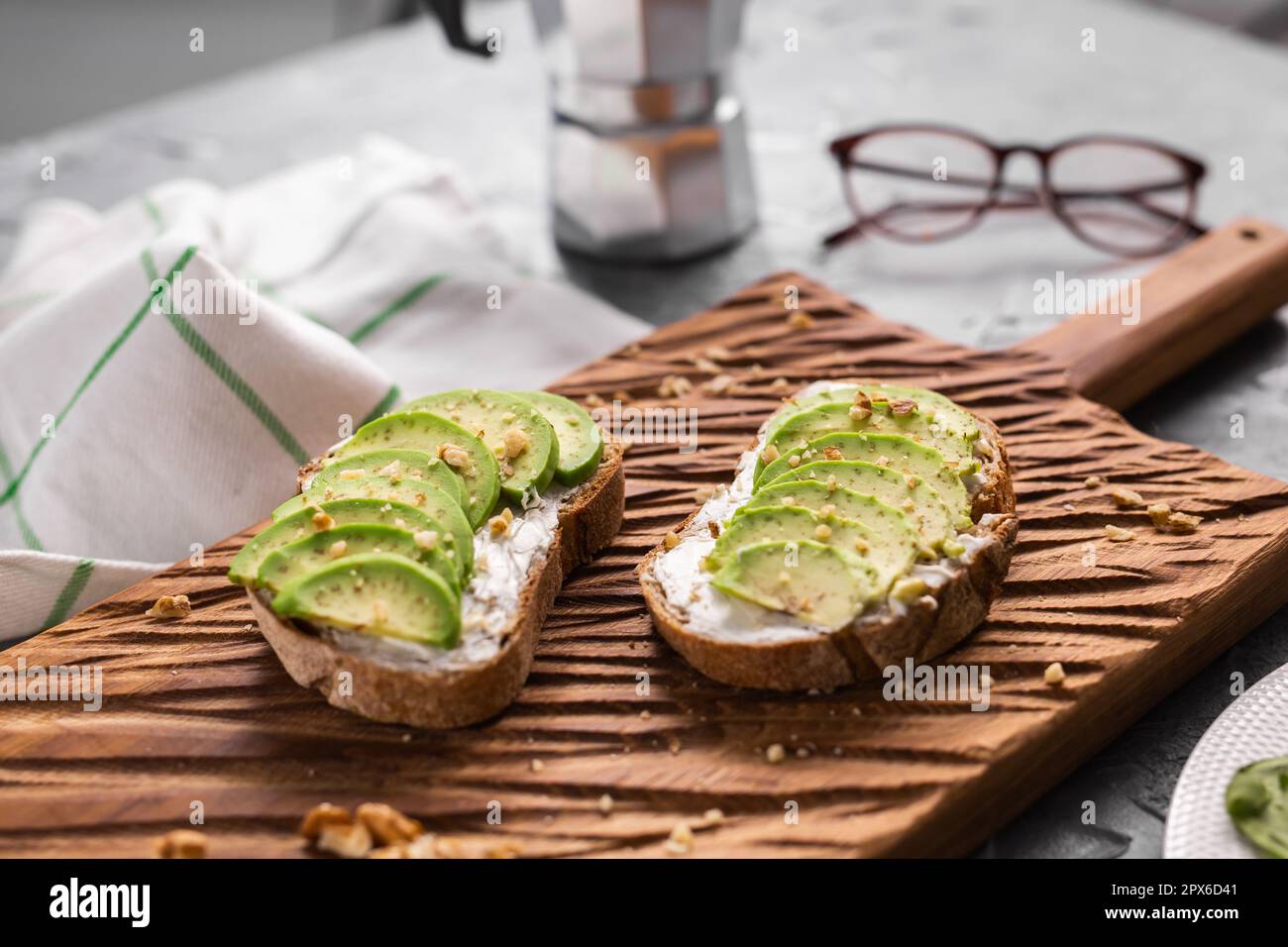 Avocado sandwich on dark rye bread made with fresh sliced avocados from ...
