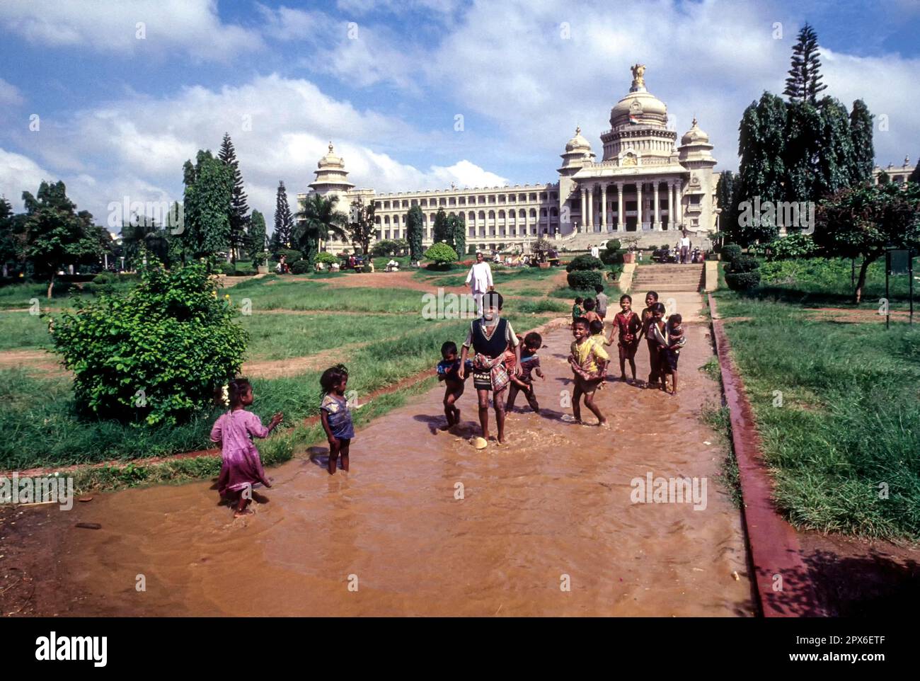 Children playing the rain water in front of Vidhana Soudha, the ...