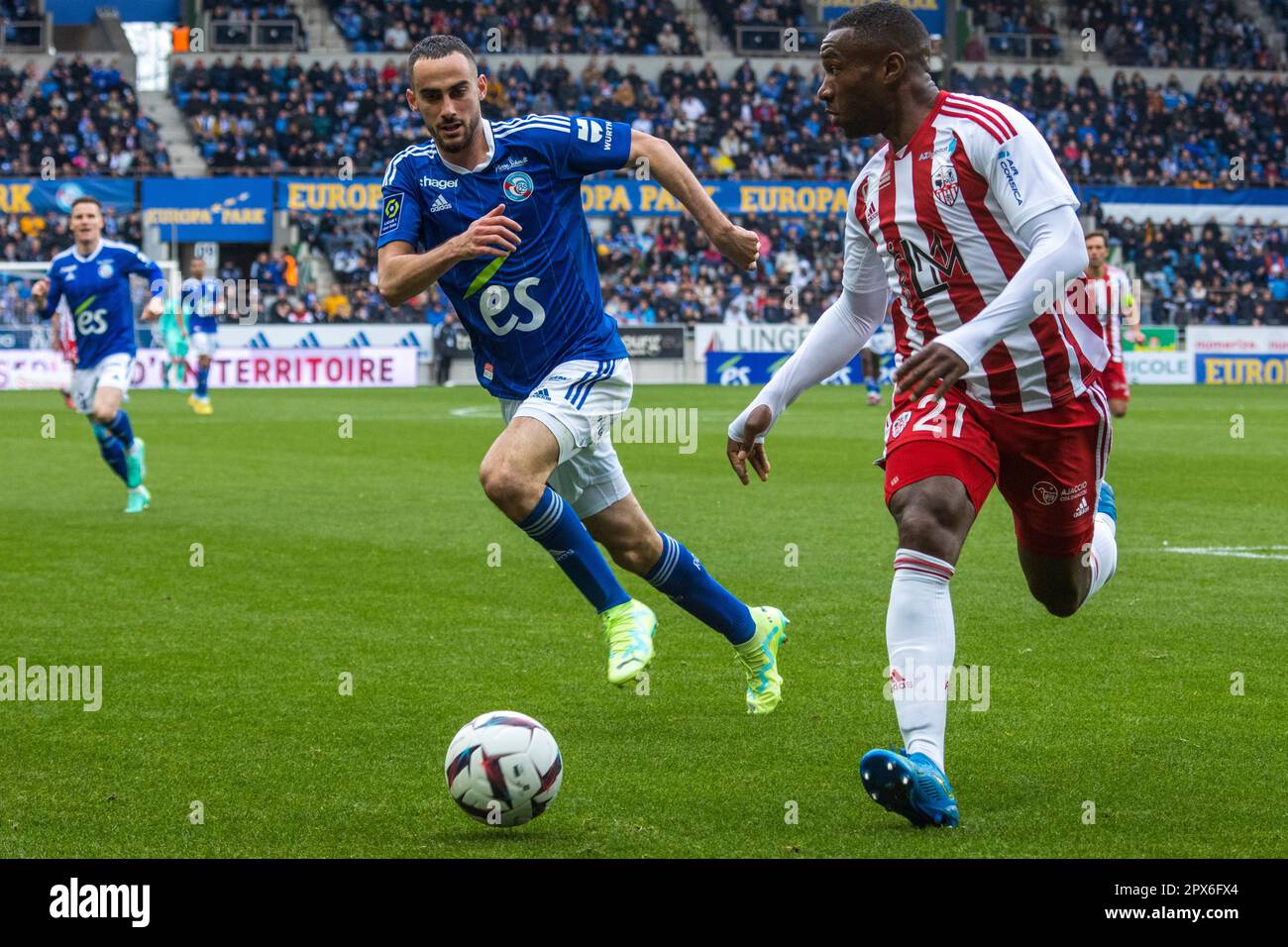 Lucas PERRIN (Racing Strasbourg) in a duel with Cedric AVINEL (Ajaccio ...