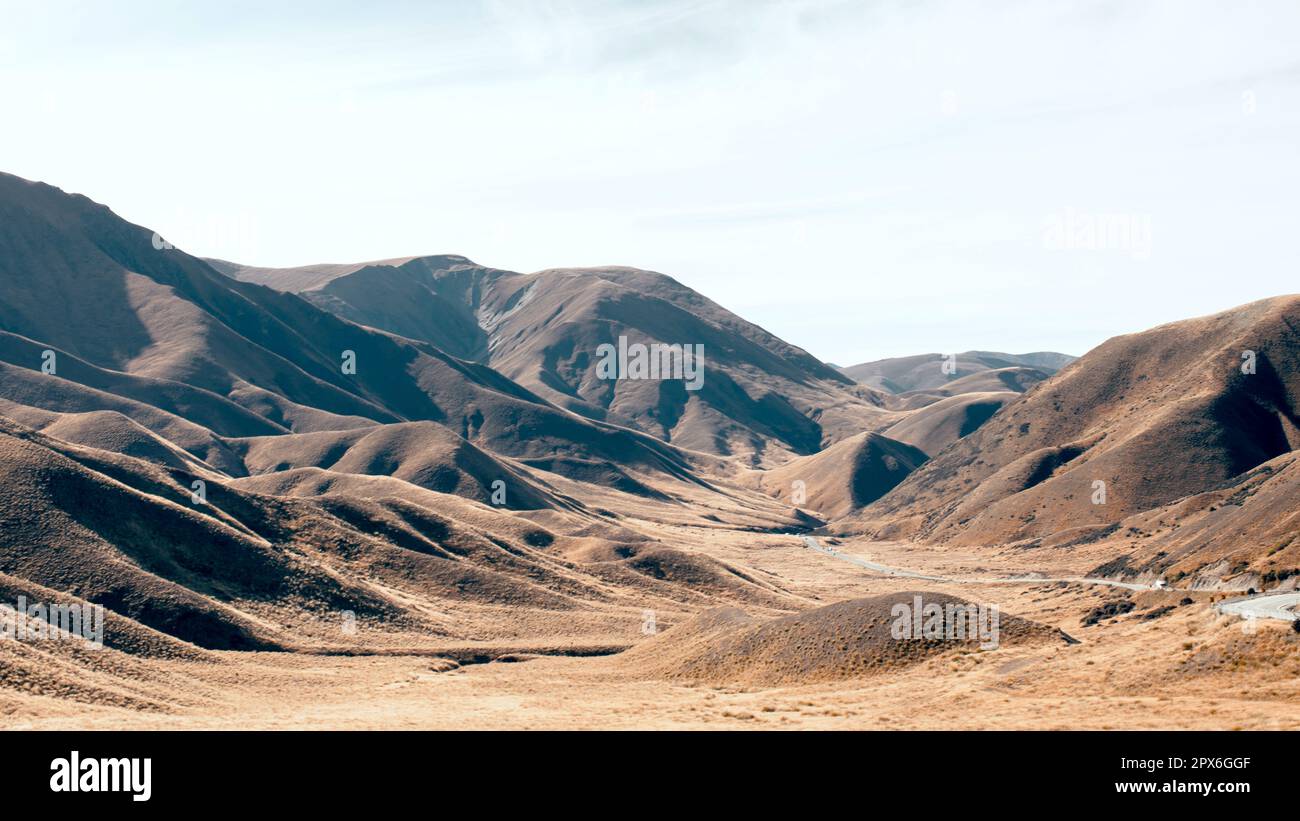 Long road on a mountain pass in New Zealand. Travel Stock Photo - Alamy
