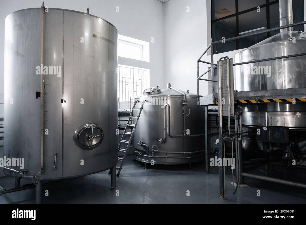 interior of a modern factory brewery with tanks inside Stock Photo - Alamy