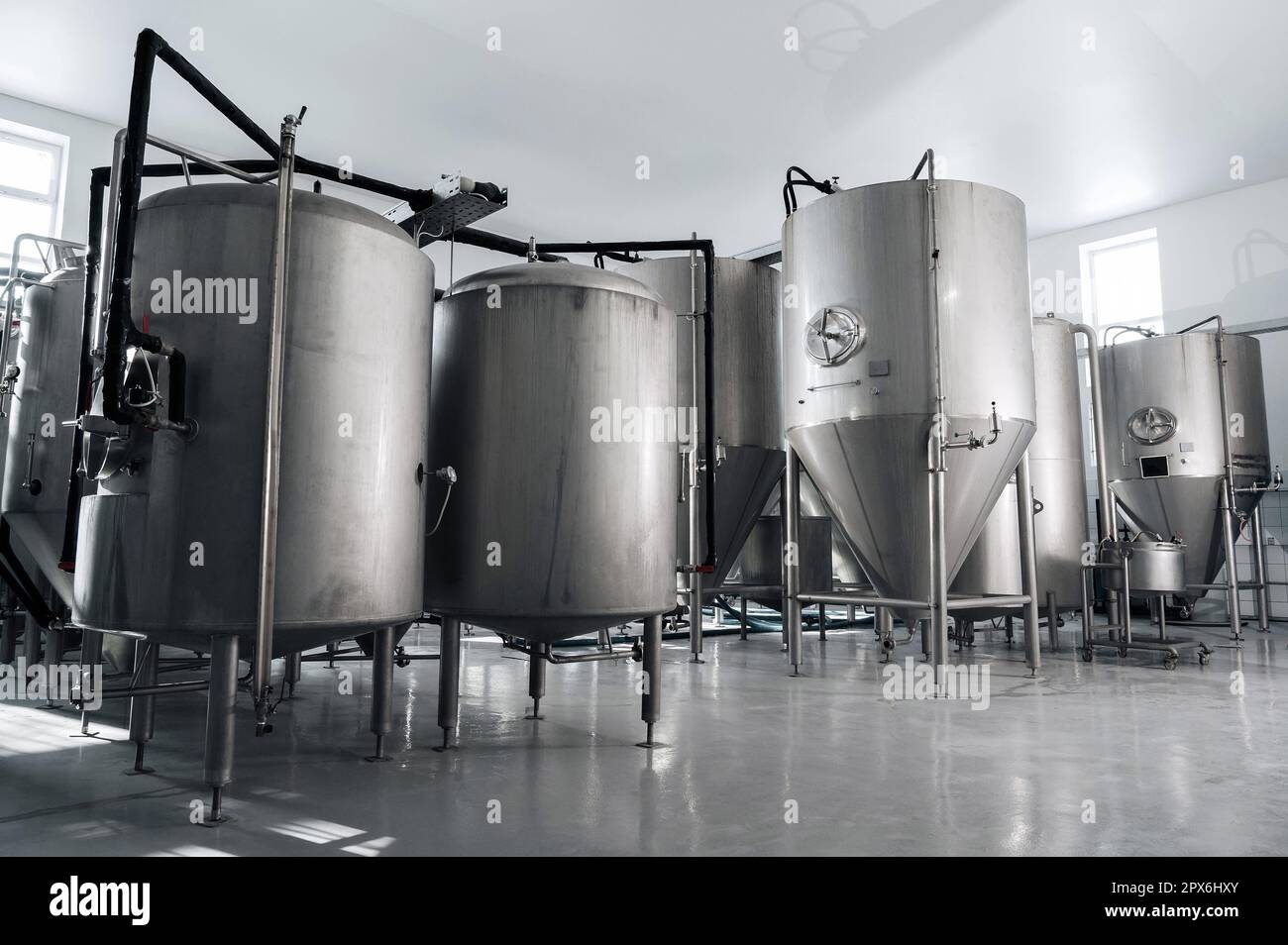 interior of a modern factory brewery with tanks inside Stock Photo - Alamy