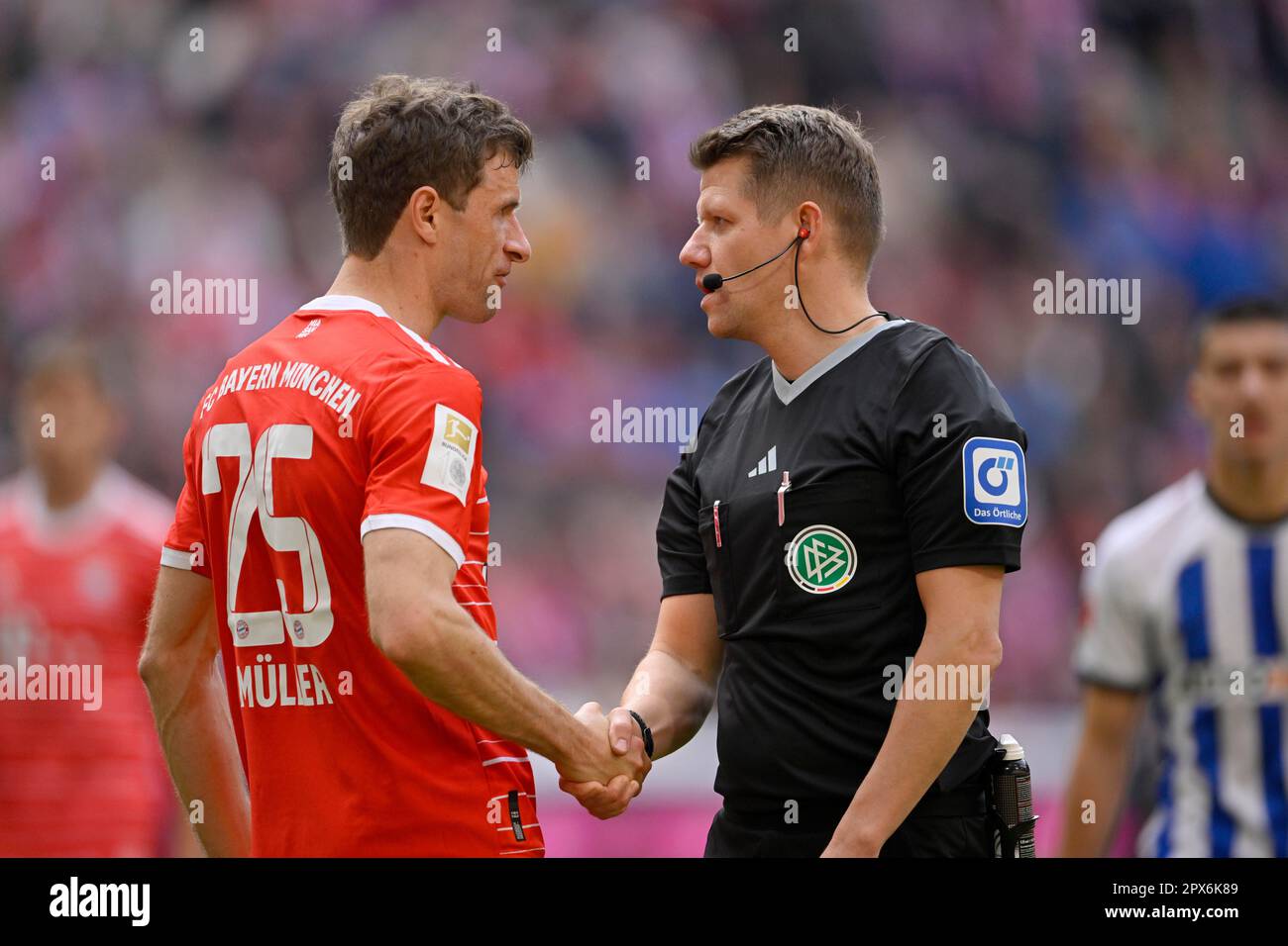 Referee Patrick Ittrich, shakes hands with Thomas Mueller FC Bayern ...