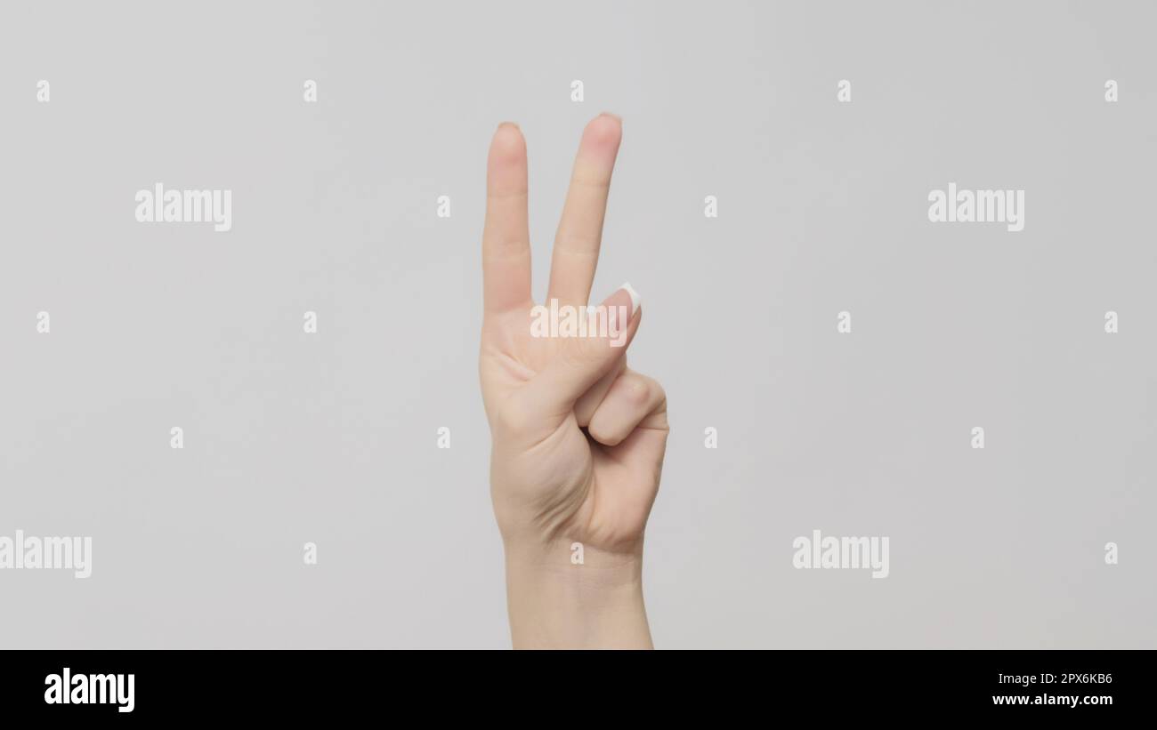 Hand gesture two number woman counting fingers Stock Photo - Alamy