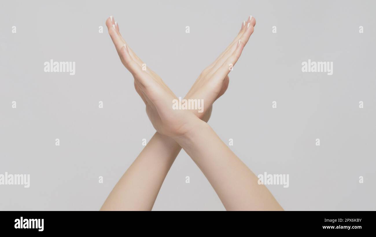 Protest sign stop signal woman crossed hands gray Stock Photo - Alamy