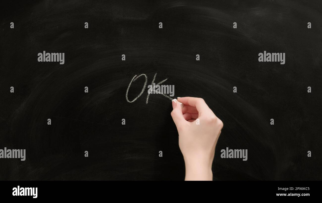 Ok lettering approval sign hand writing chalkboard Stock Photo - Alamy