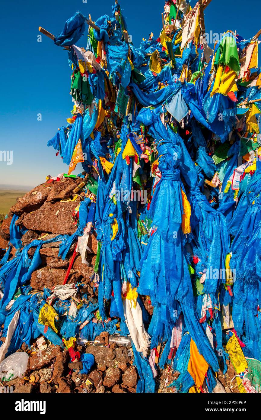 The colorful top of a so-called "Owoo", a pile of stones with colorful ...